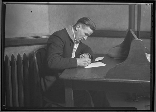 Black Man Writing A Letter