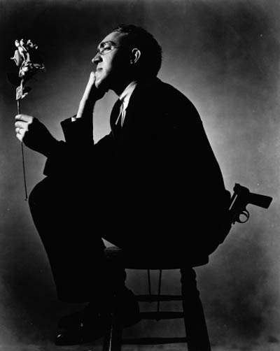Ralph Steiner | S.J. Perlman with gun and rose (1935) | MutualArt