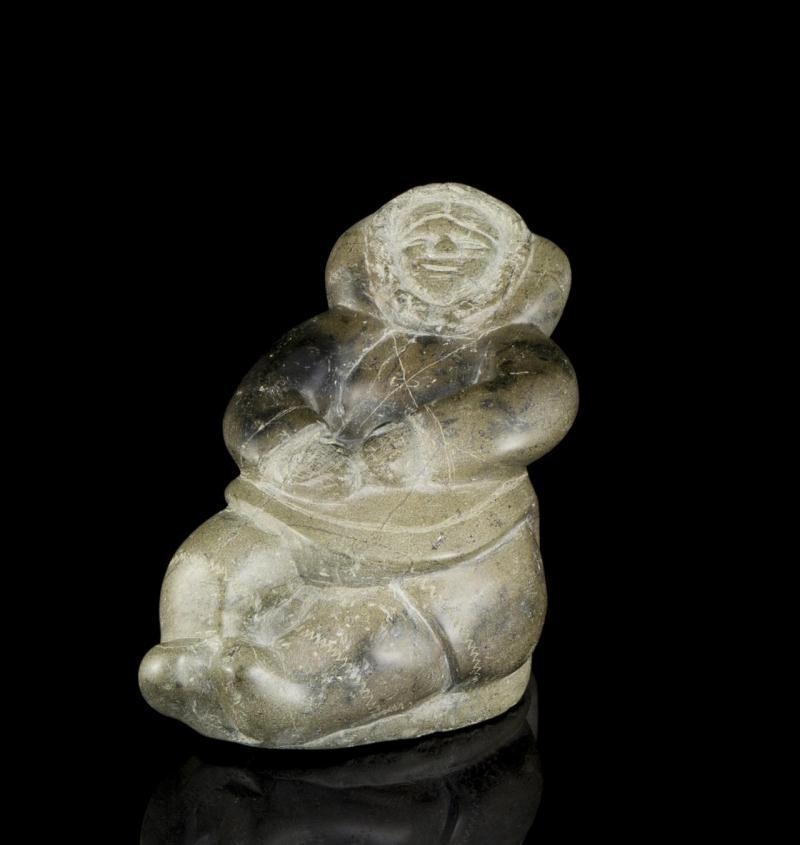 Inuit School, 20th century | A Serpentine Carving of a Seated Inuk ...