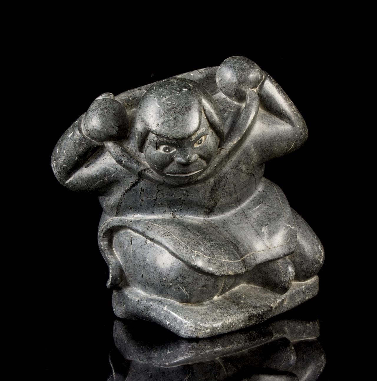 Isa Sheeq | A green stone carving of an Inuk | MutualArt