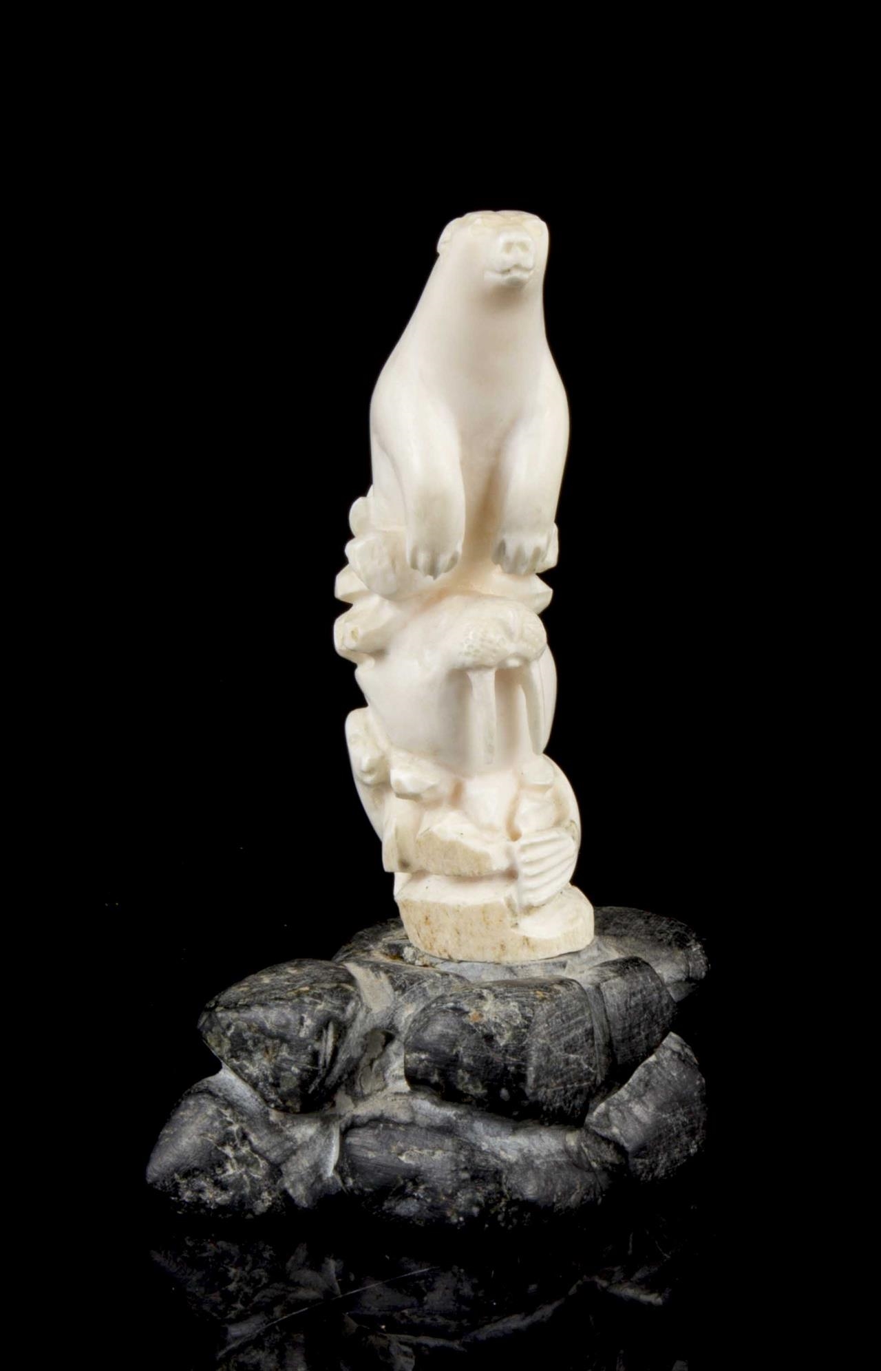 Pierre Karlik | A walrus ivory carving of a polar bear, musk ox, walrus ...