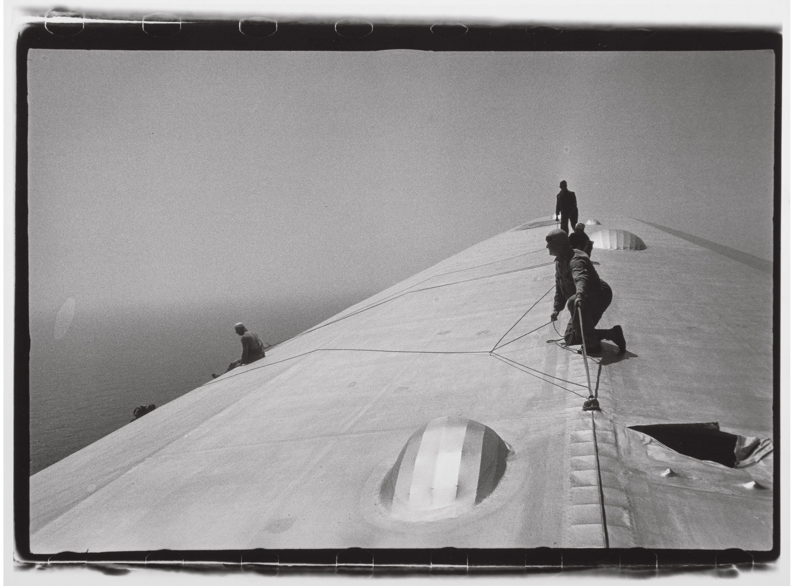 Alfred Eisenstaedt | Repairing the Hull of the Graf Zeppelin during the flight over the Atlantic ...