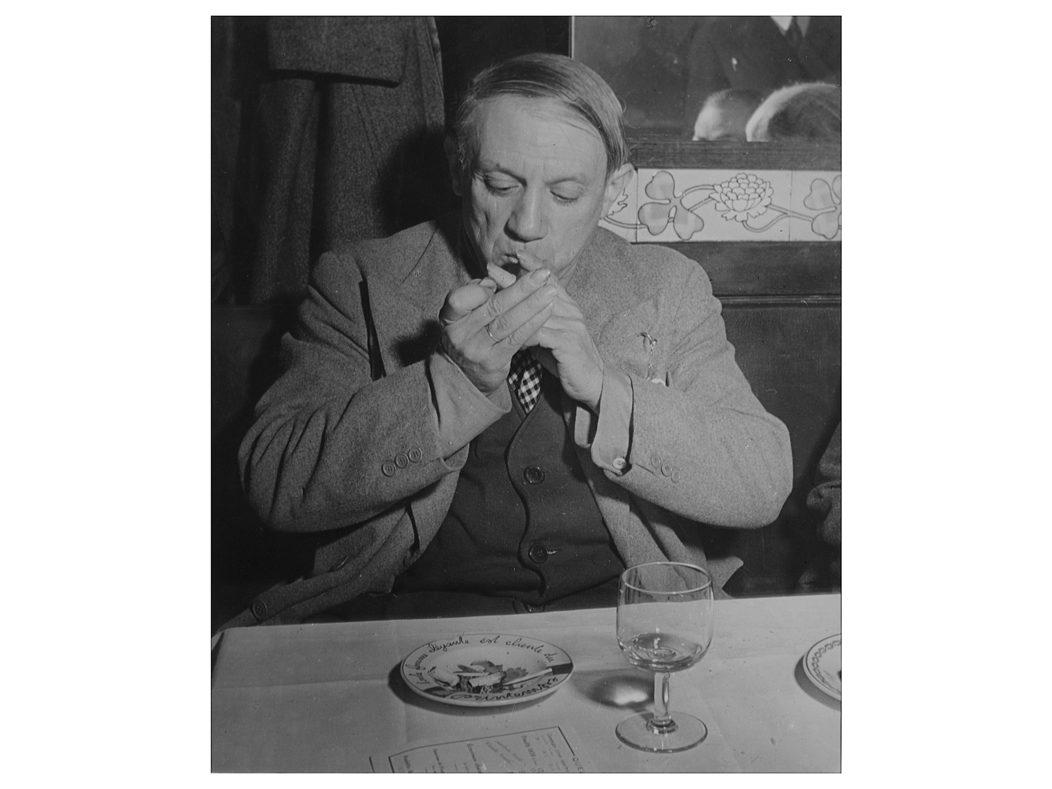 Brassaï | PICASSO LIGHTING A PIPE (Circa 1940) | MutualArt