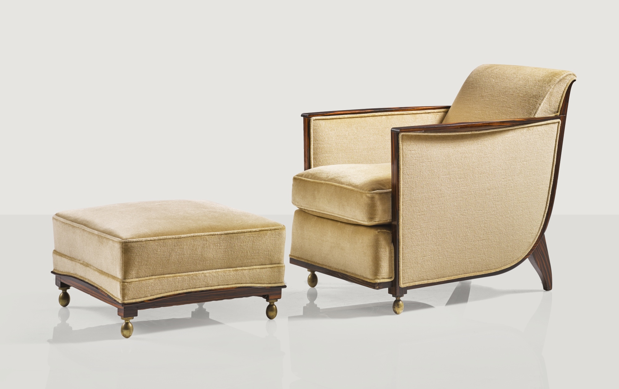 Émile-Jacques Ruhlmann | 2 WORKS: CUELLAR ARMCHAIR AND OTTOMAN | MutualArt