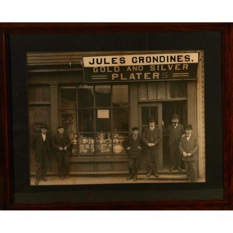 Isaac Erb | MEN STANDING IN FRONT OF JULES GRONDINES GOLD AND SILVER ...