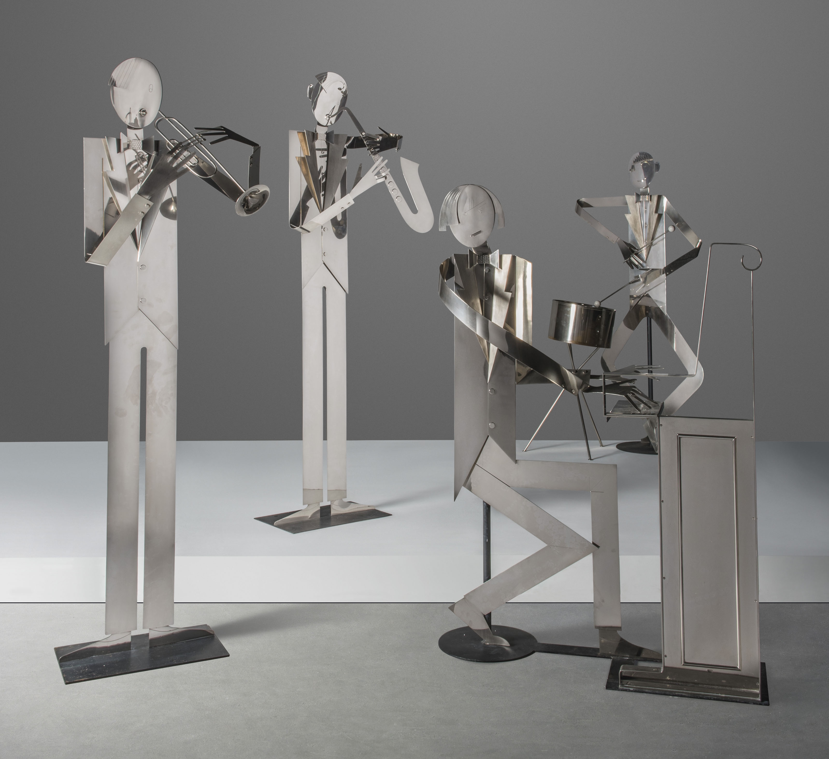 Hagenauer Werkstätte | A RARE GROUP OF FOUR LIFE-SIZE MUSICIANS ...