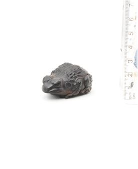 Seiyodo Tomiharu | An ebony netsuke of a frog on a lotus leaf | MutualArt
