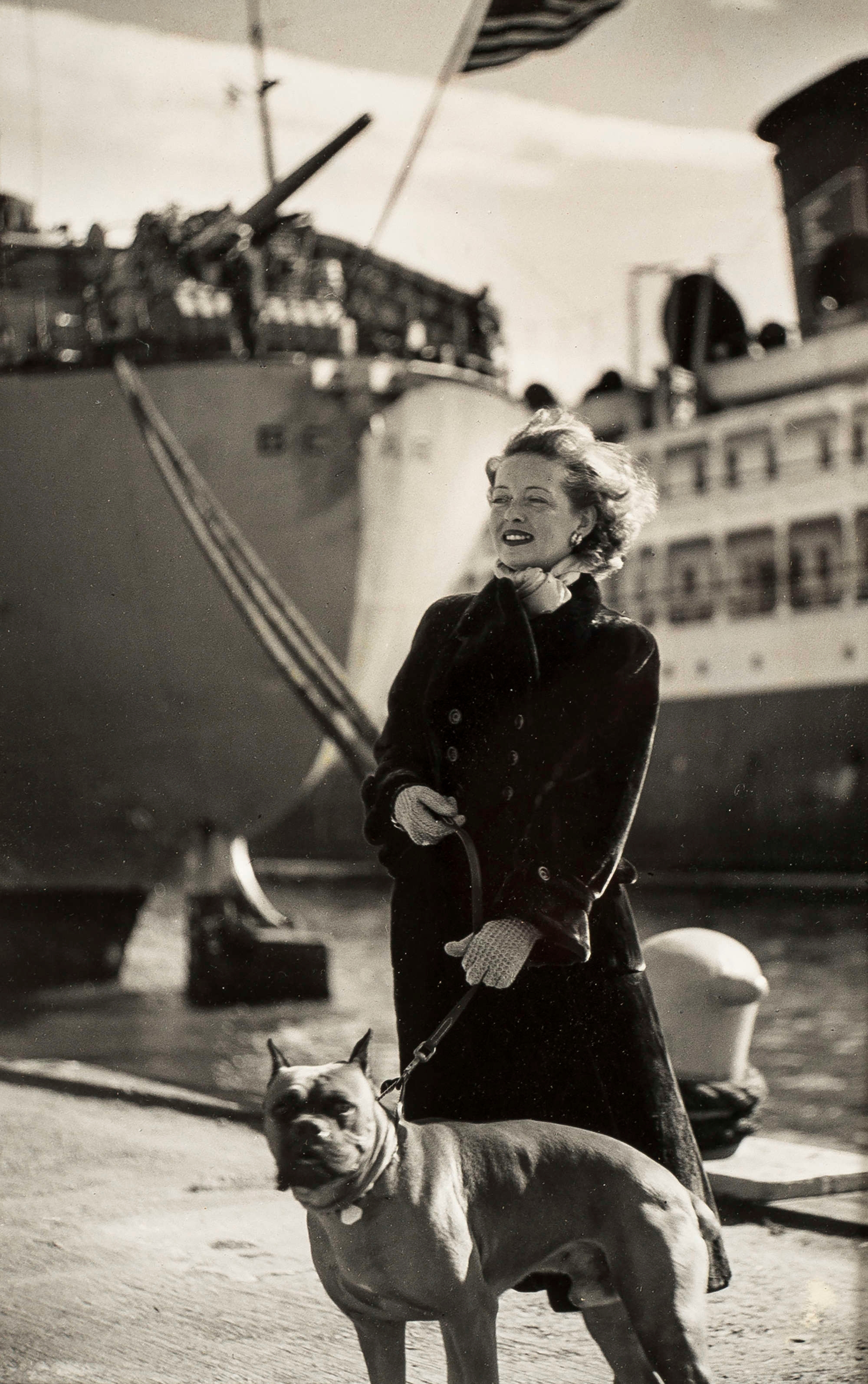 Ronny Jaques | Bette Davis, walking her dog in New York docks | MutualArt