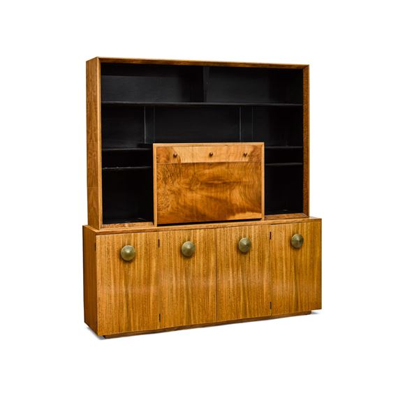 Gilbert Rohde | Dropfront Desk Bookcase Unit on Cabinet | MutualArt