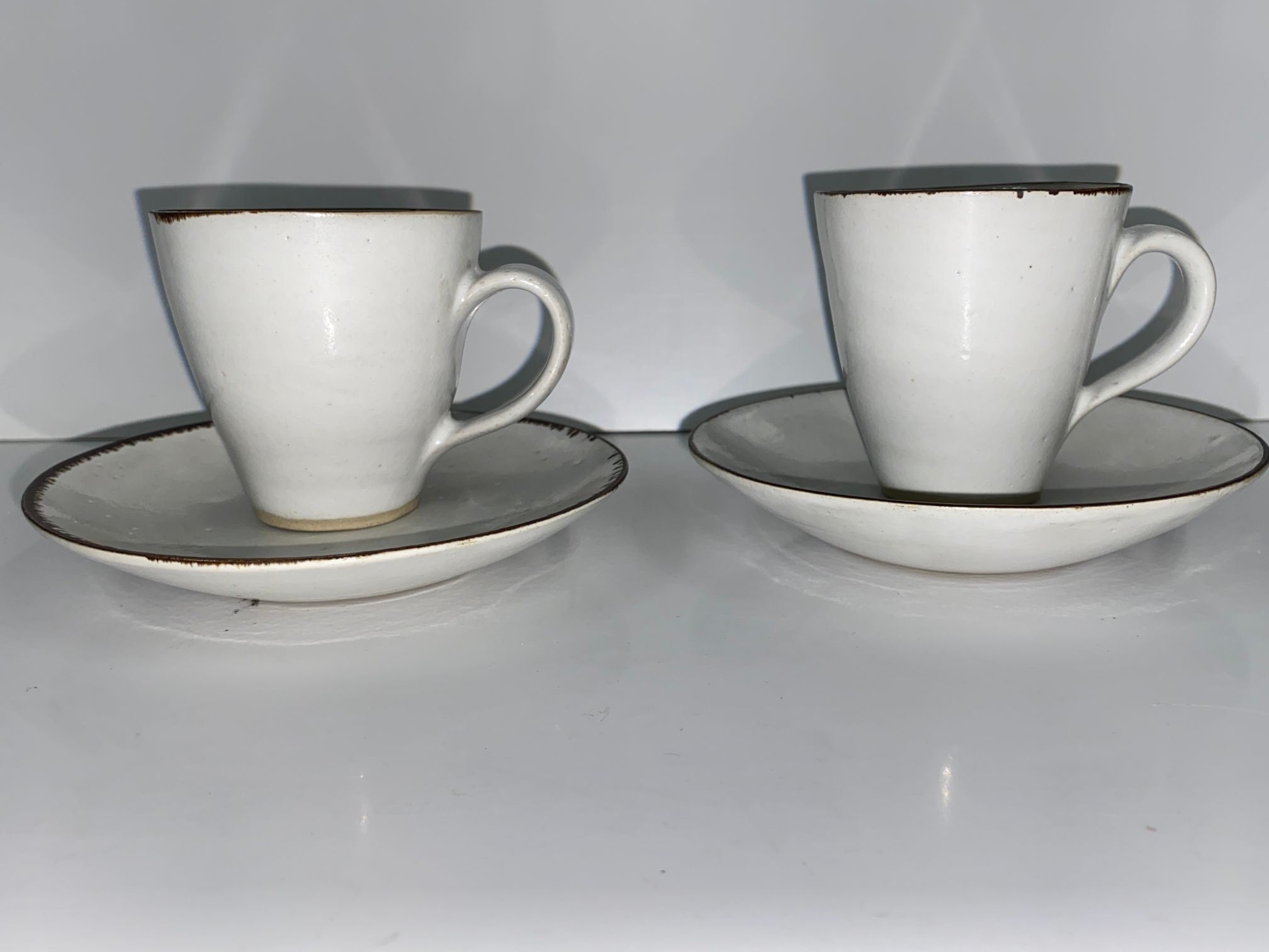 Lucie Rie | Lucie Rie (1902-1995) A pair of cream glazed stoneware ...