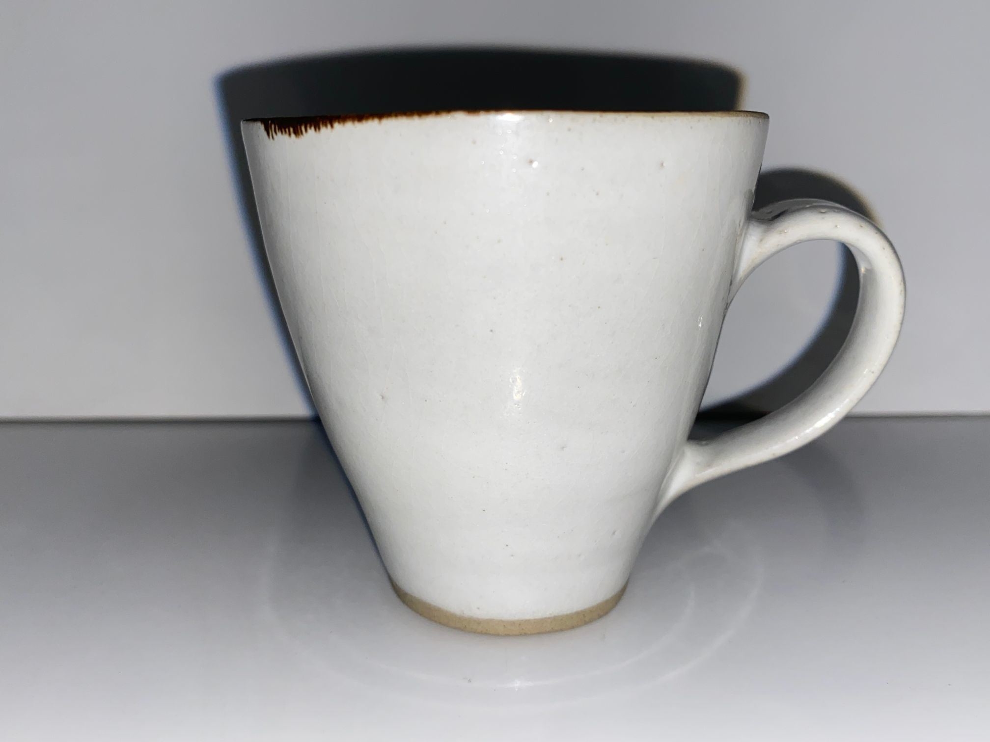 Lucie Rie | Lucie Rie (1902-1995) A pair of cream glazed stoneware ...