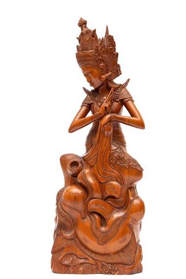 Balinese School 20th Century | A Balinese wood carved figure of Dewi ...
