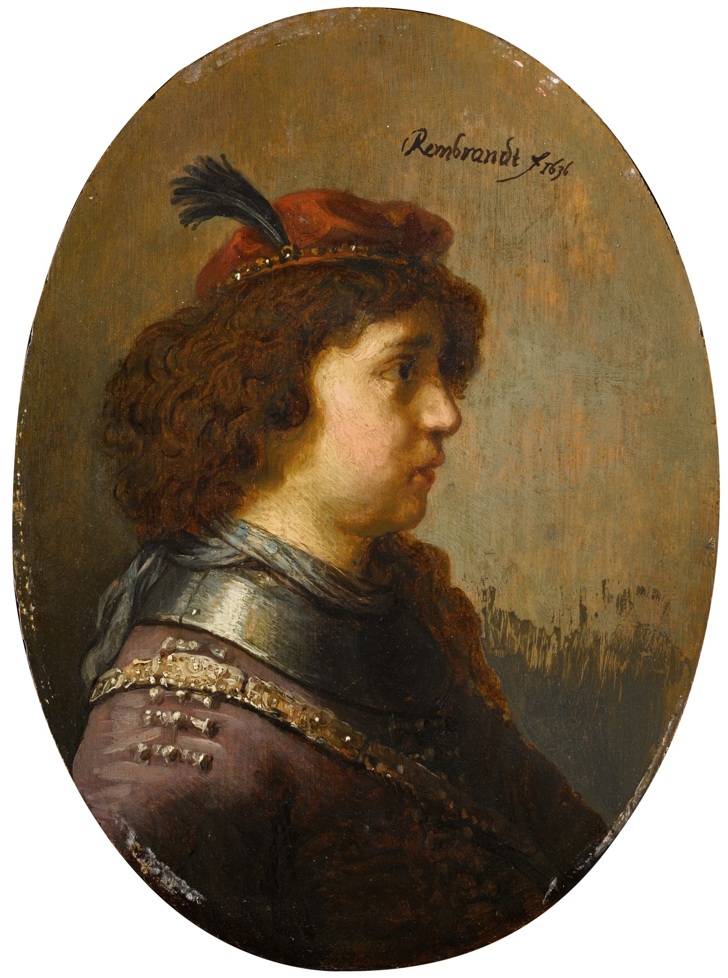 Rembrandt van Rijn | Portrait of a young man in armour and a red ...