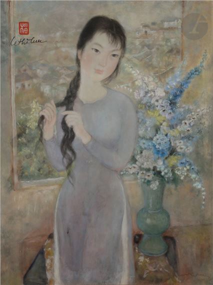 Le Thi Luu | Young girl redoing her mat in front of a low table on ...