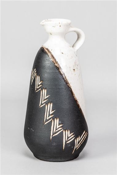 Barbara Cass | a stoneware bottle with side handle partially covered in ...