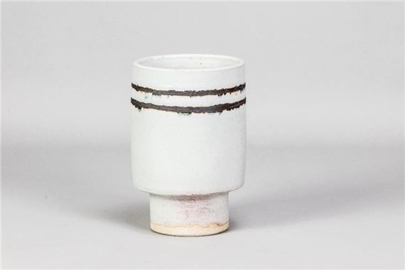 Derek Davis | a cylindrical porcelain footed vase covered in chun glaze ...