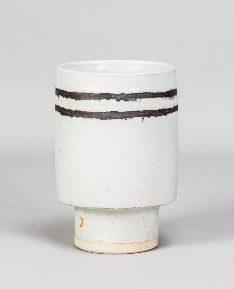 Derek Davis | a cylindrical porcelain footed vase covered in chun glaze ...