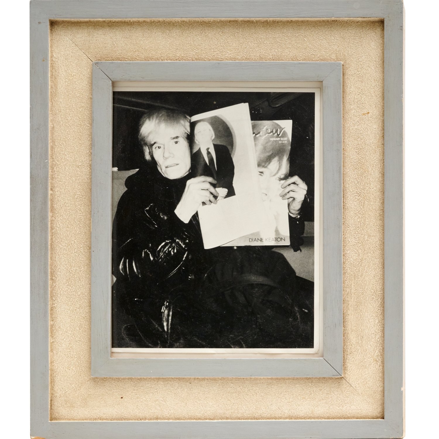 Andy Warhol | Andy Warhol holding Interview magazine open to picture of ...
