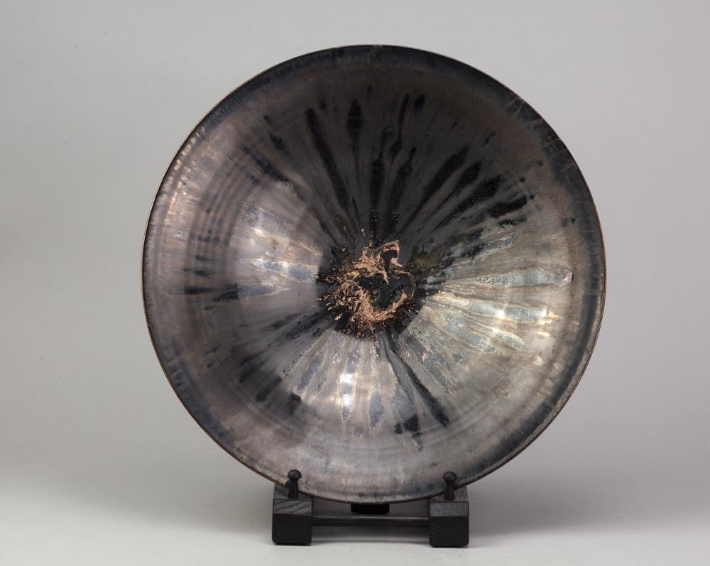 Abdo Nagi | a large stoneware bowl covered in metallic bronze glaze ...