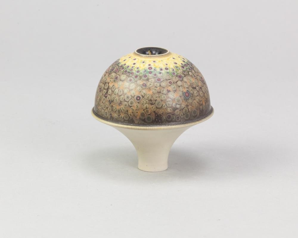 Geoffrey Swindell | a small porcelain vessel partially covered in ...