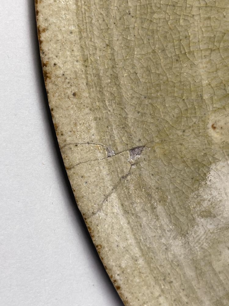 Glynn Hugo | a stoneware pedestal form with a wide disc rim covered in ...