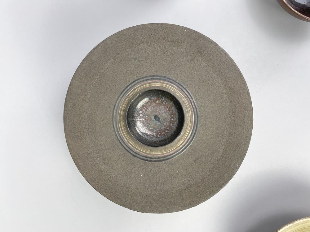 Glynn Hugo | a stoneware pedestal form with a wide disc rim covered in ...