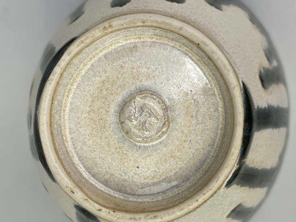 Valerie Rees | a small stoneware vase squeezed to an oval at the rim ...