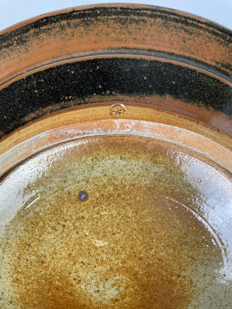 Ray Finch | a stoneware charger covered in iron rich glaze with meander ...