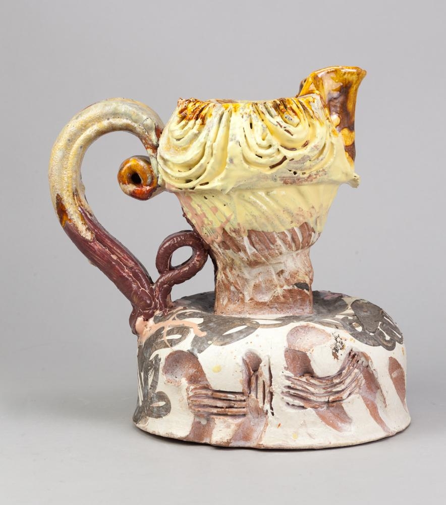 Simon Carroll | an earthenware jug with large foot covered in coloured ...