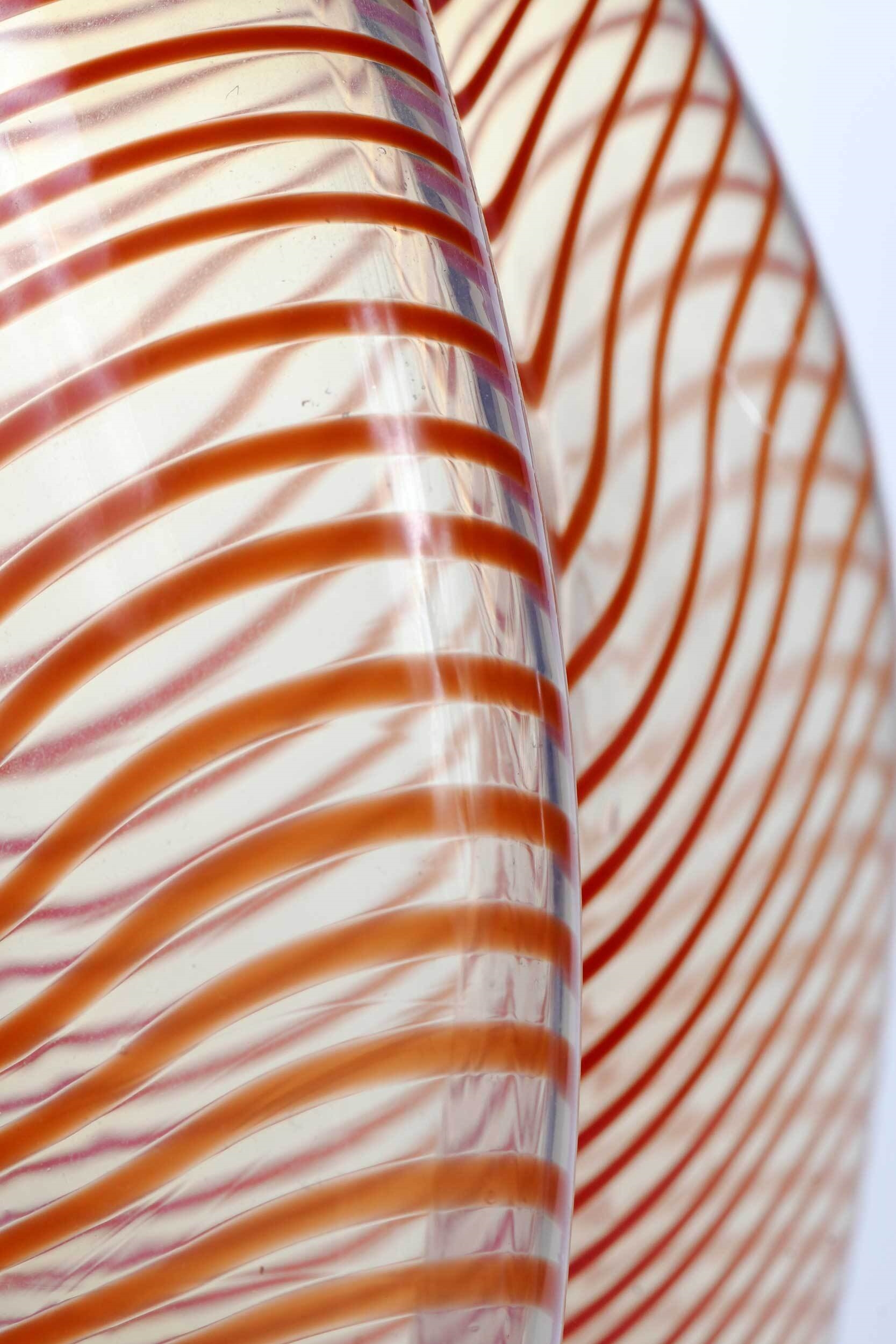 Stephen Rolfe Powell | Blown glass vase with orange wrap (1986) | MutualArt