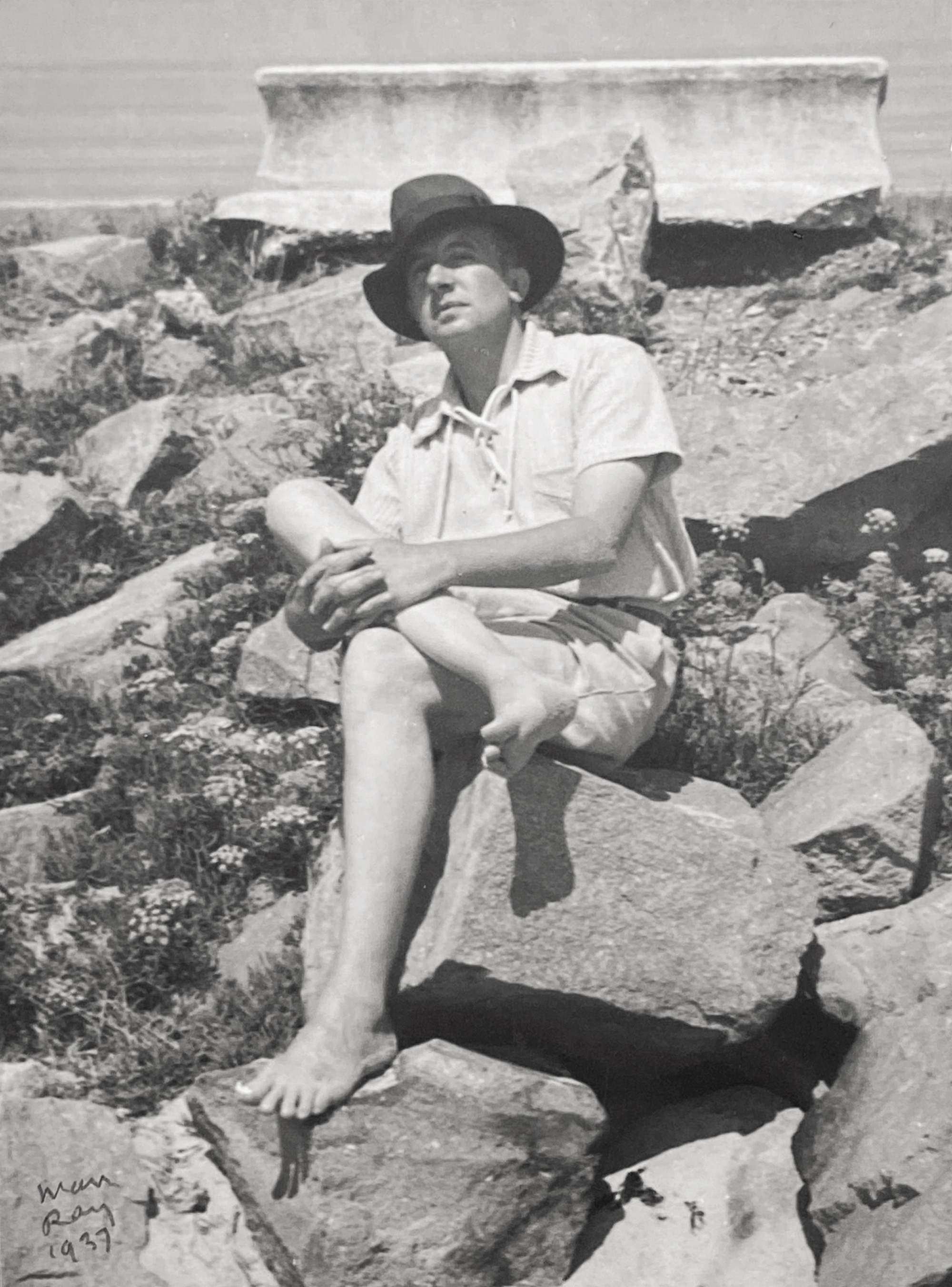 Man Ray | PAUL ELUARD, SEATED ON BREAKWATER (1937) | MutualArt