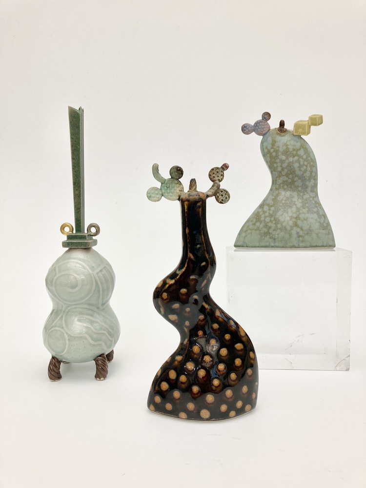 Adrian Saxe | Two cactus oil lamps and a flower vase, | MutualArt