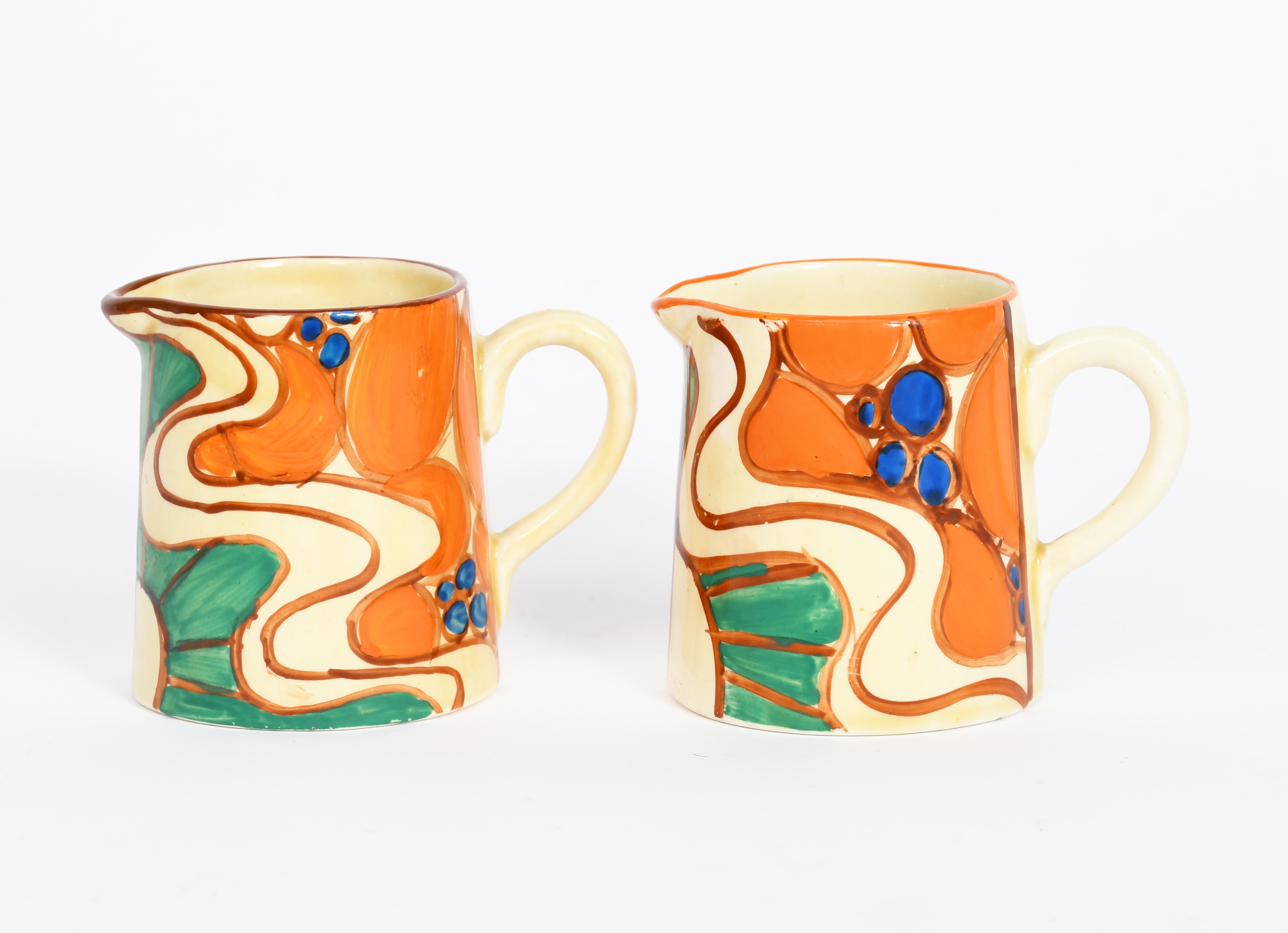 Clarice Cliff | 'Sunrise' a pair of Clarice Cliff Bizarre Tankard milk ...