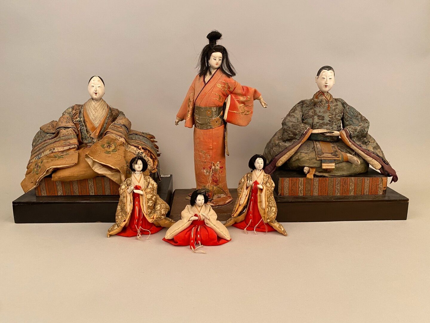 Japanese School, 20th Century | Six gofun dolls dressed in silk robes ...