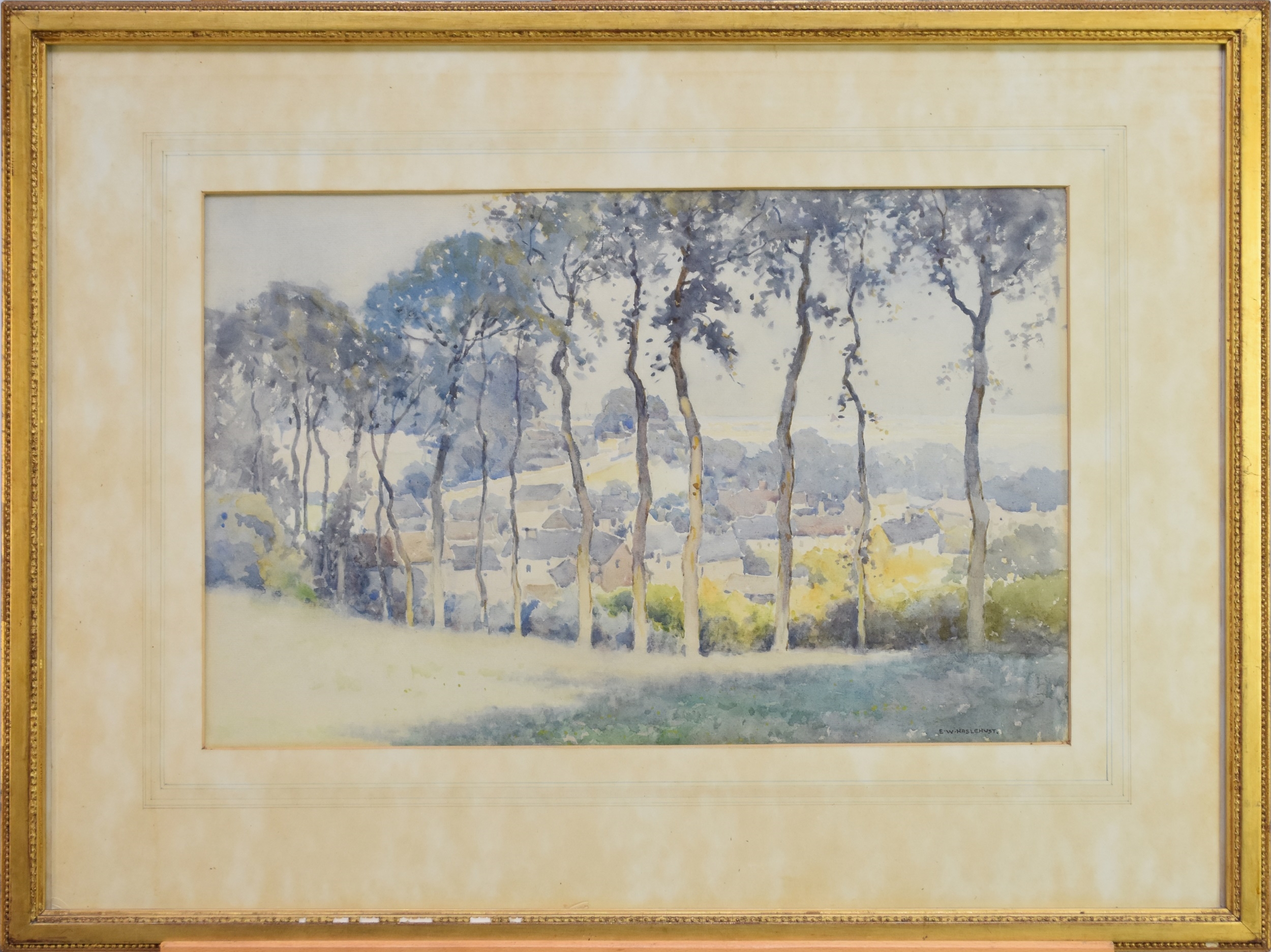 Ernest W. Haslehust | Rural Landscape with Cottages Beyond the Trees ...