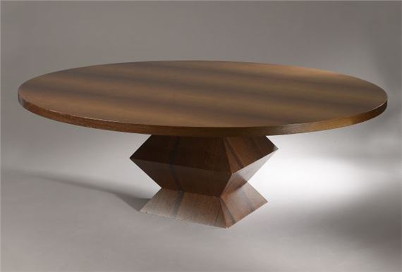 Christian Liaigre | Large round table in light wenge veneer resting ...