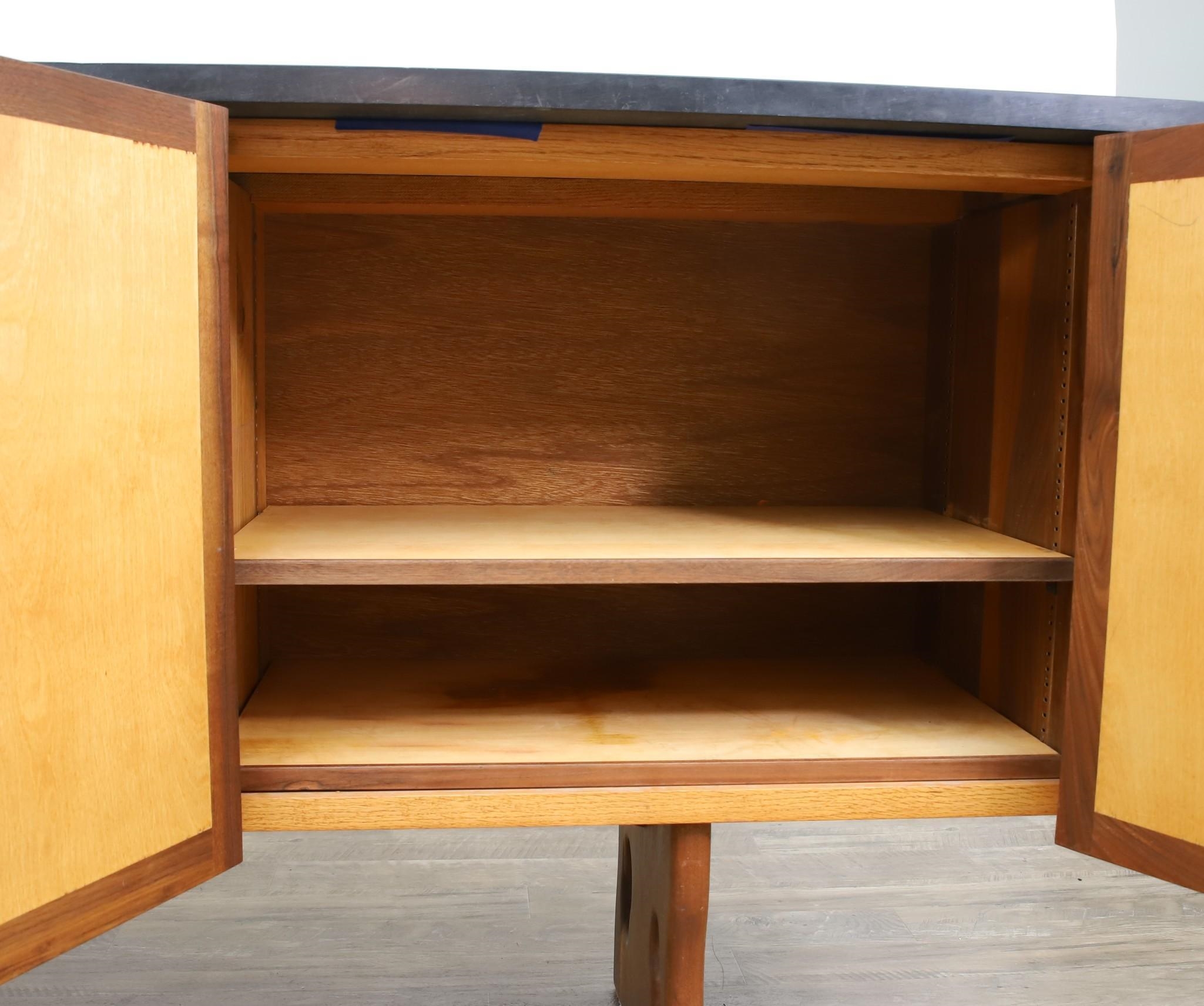 Gino Russo | four chip-carved chiseled doors opening to shelving and a ...