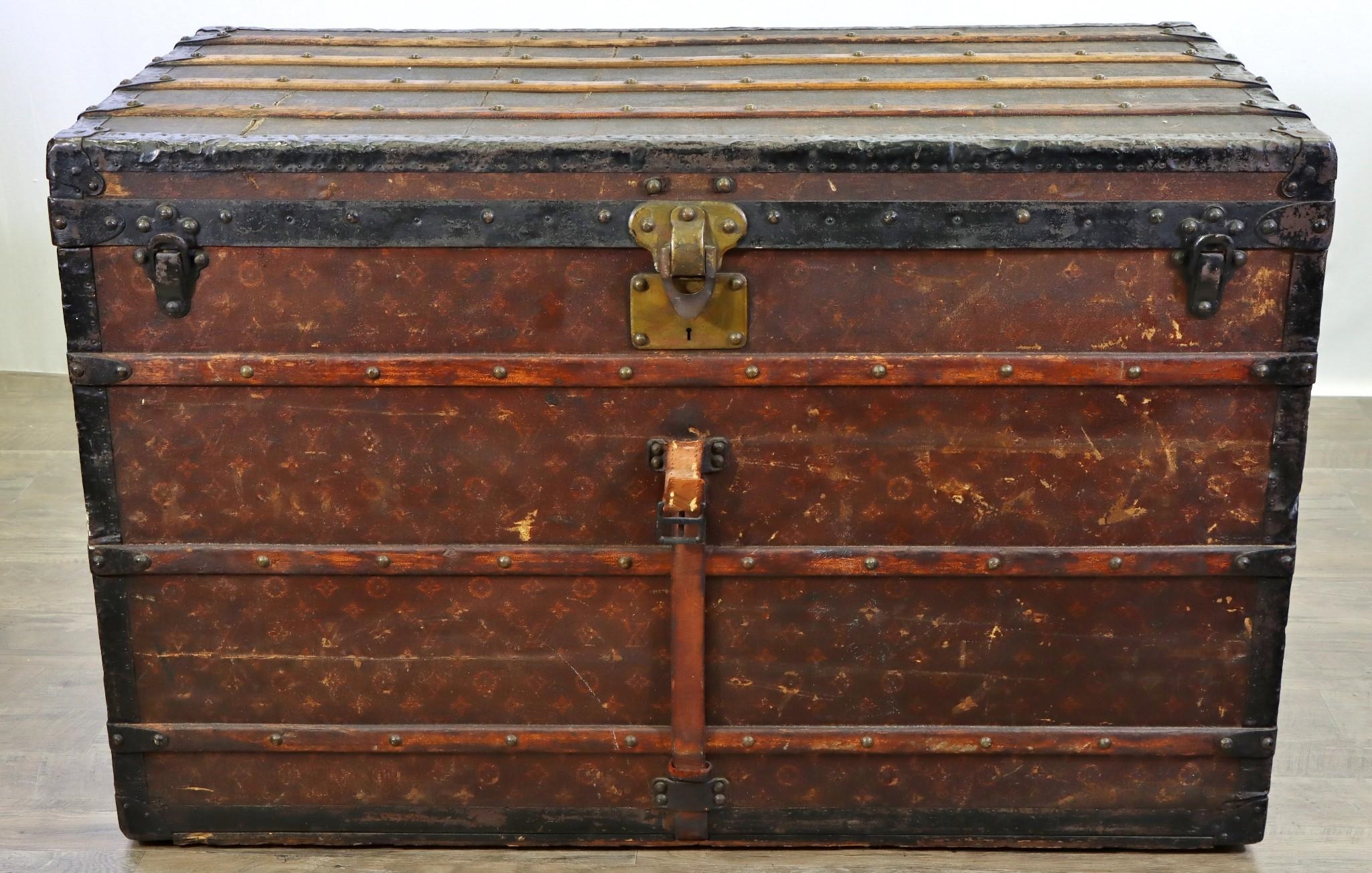 Louis Vuitton | wood and monogrammed stenciled canvas trunk | MutualArt