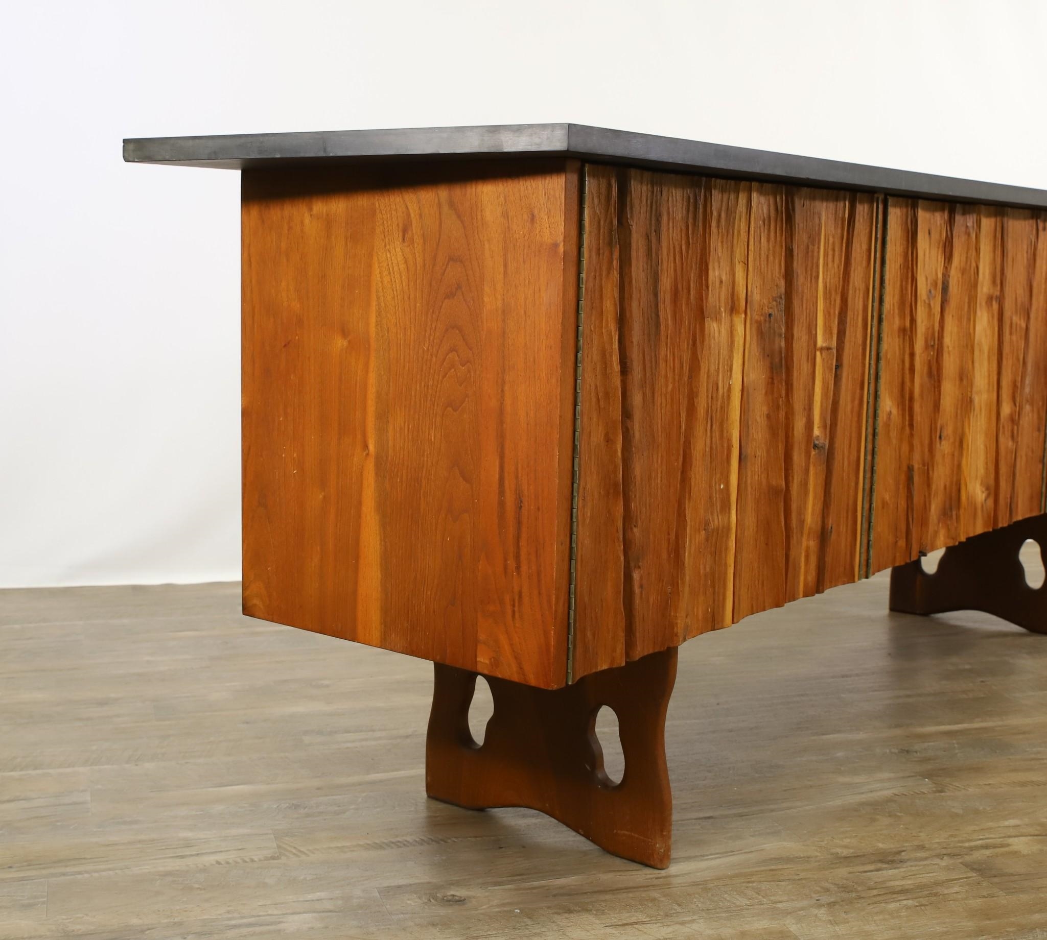 Gino Russo | four chip-carved chiseled doors opening to shelving and a ...