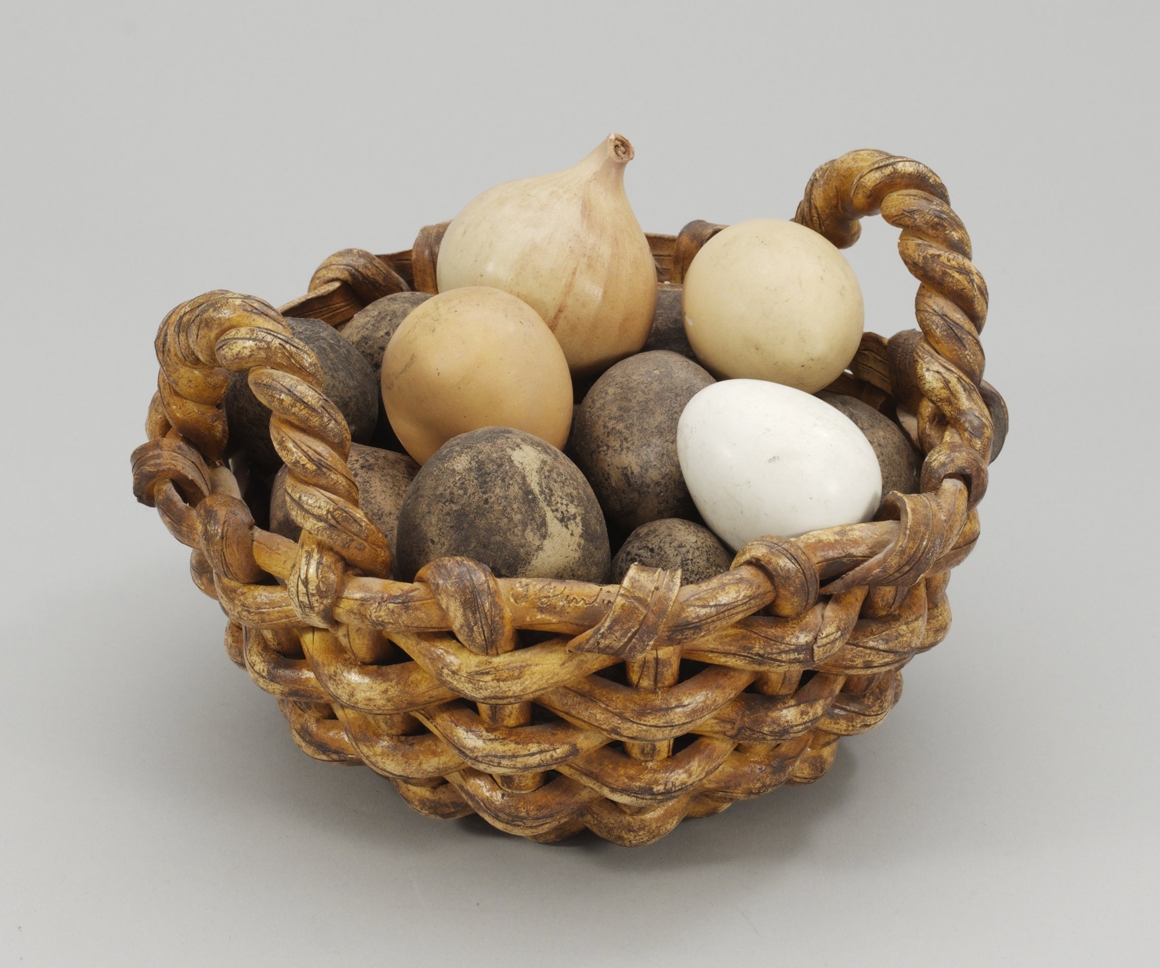 Ingrid Herrlin | An Ingrid Herrlin stoneware basket with potatos, onion ...