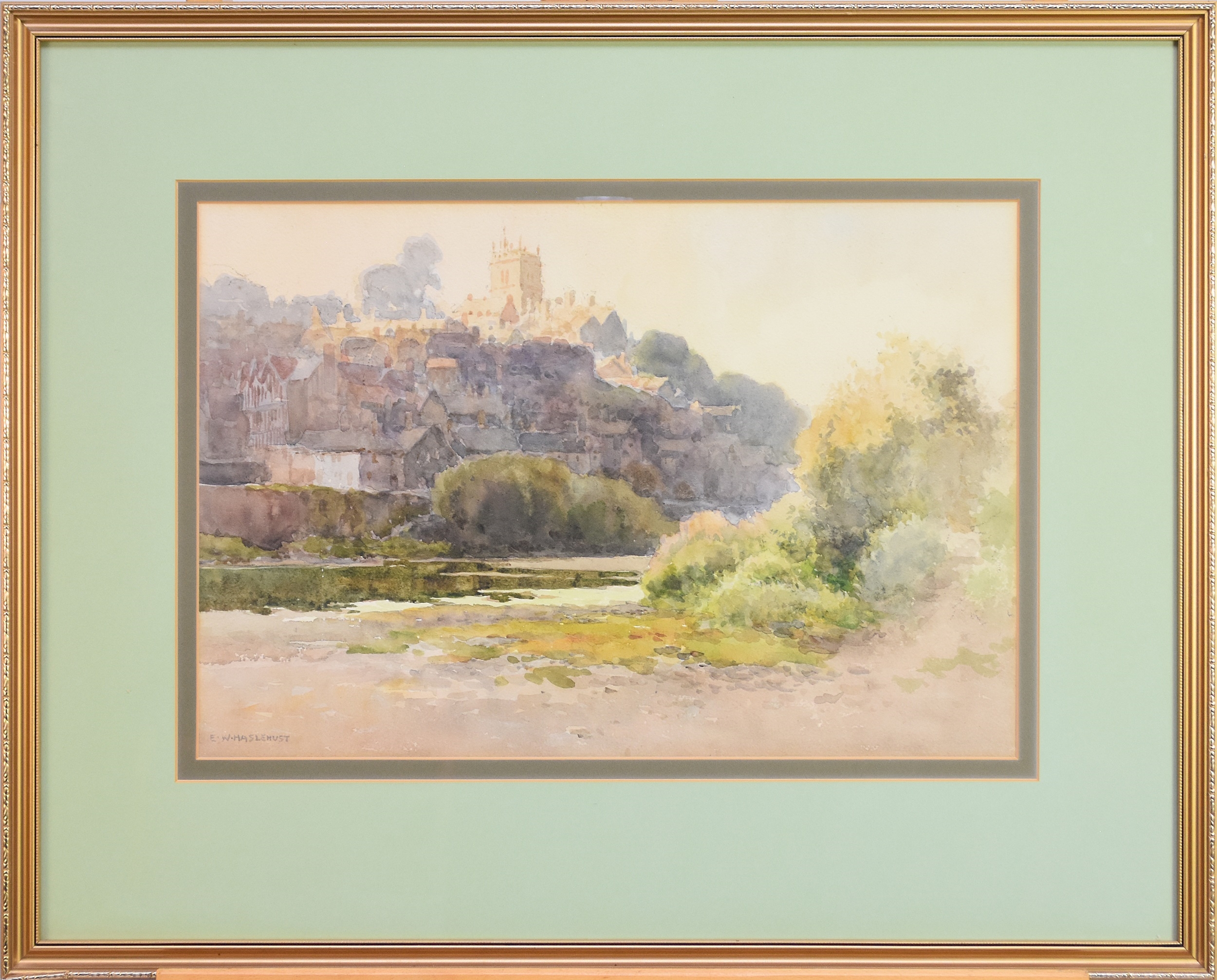 Ernest W. Haslehust | Riverside View with Town and Church Beyond ...