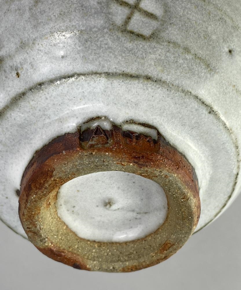 Jim Malone | a stoneware chawan covered in white glaze with impressed ...