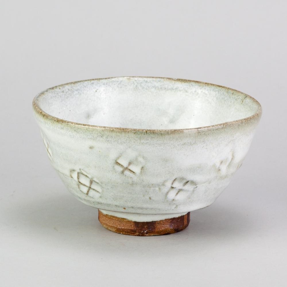 Jim Malone | a stoneware chawan covered in white glaze with impressed ...