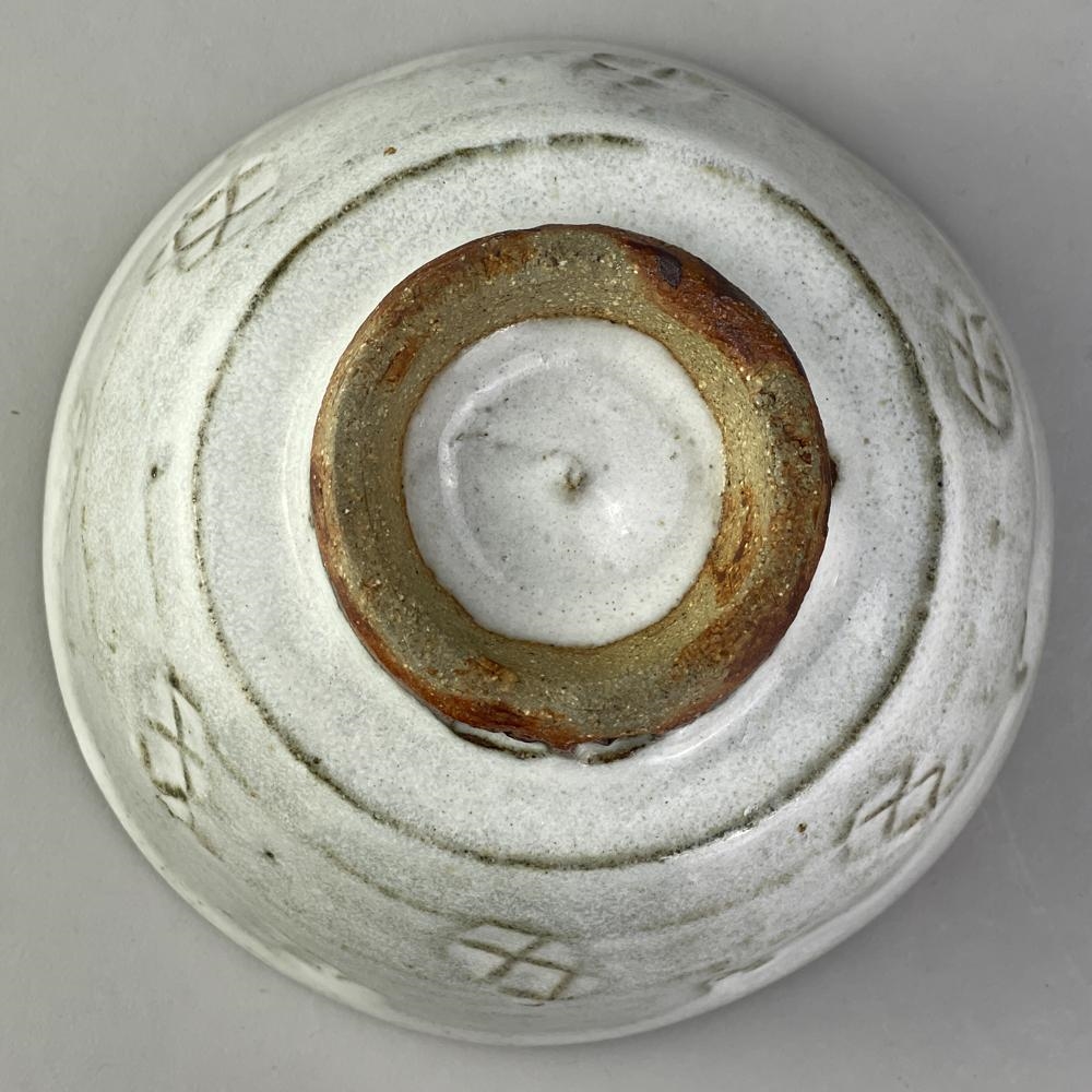 Jim Malone | a stoneware chawan covered in white glaze with impressed ...