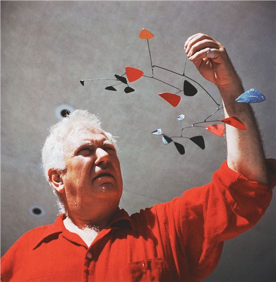 Walter Sanders | Sculptor Alexander Calder holding his colorful mobile ...
