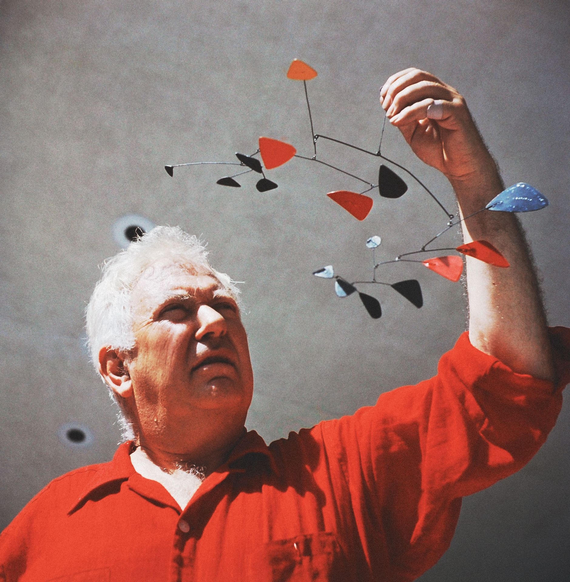 Walter Sanders | Sculptor Alexander Calder holding his colorful mobile ...