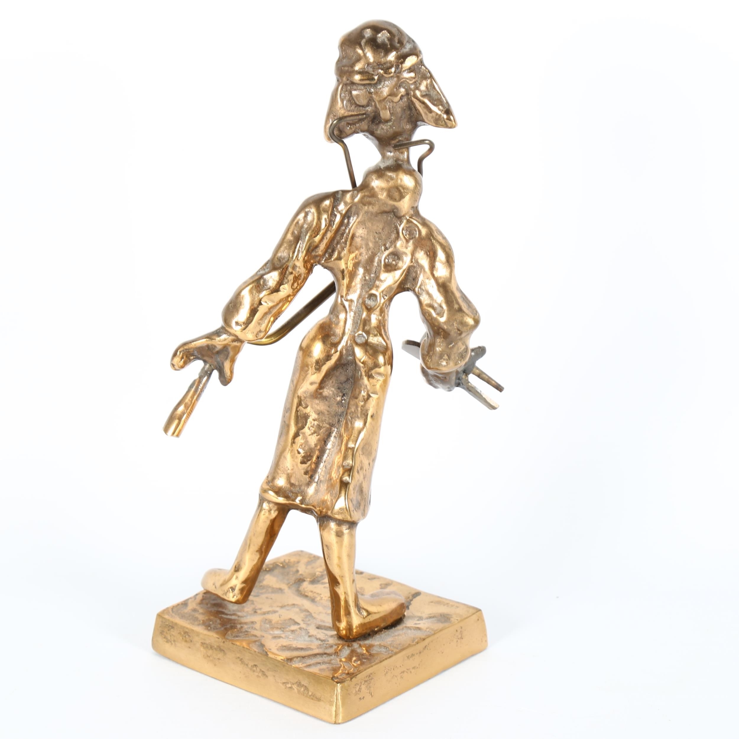 Yves Lohé | a gilded bronze sculpture of a doctor | MutualArt