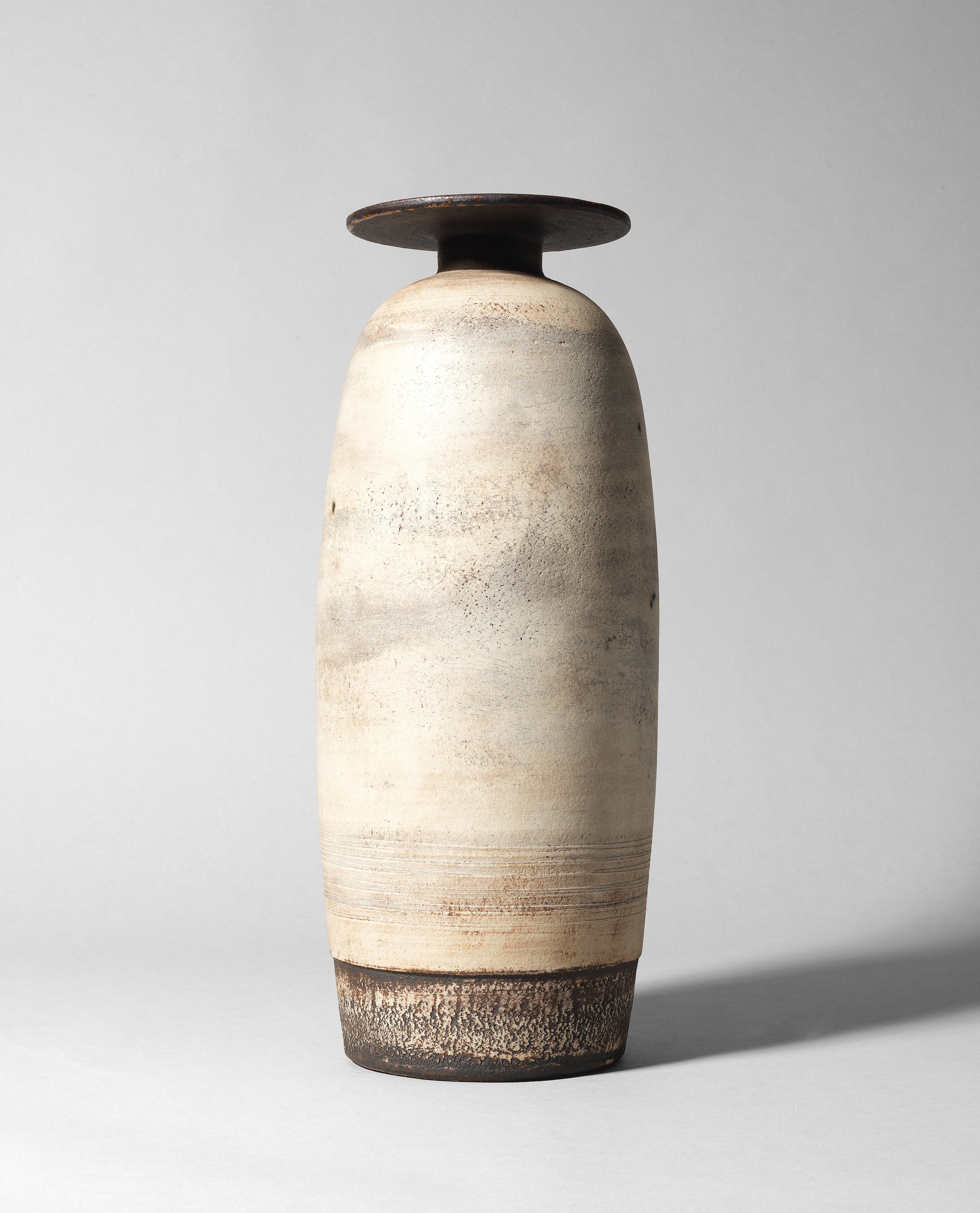 Hans Coper | Important tall bottle vase with disc, (Circa 1968) | MutualArt