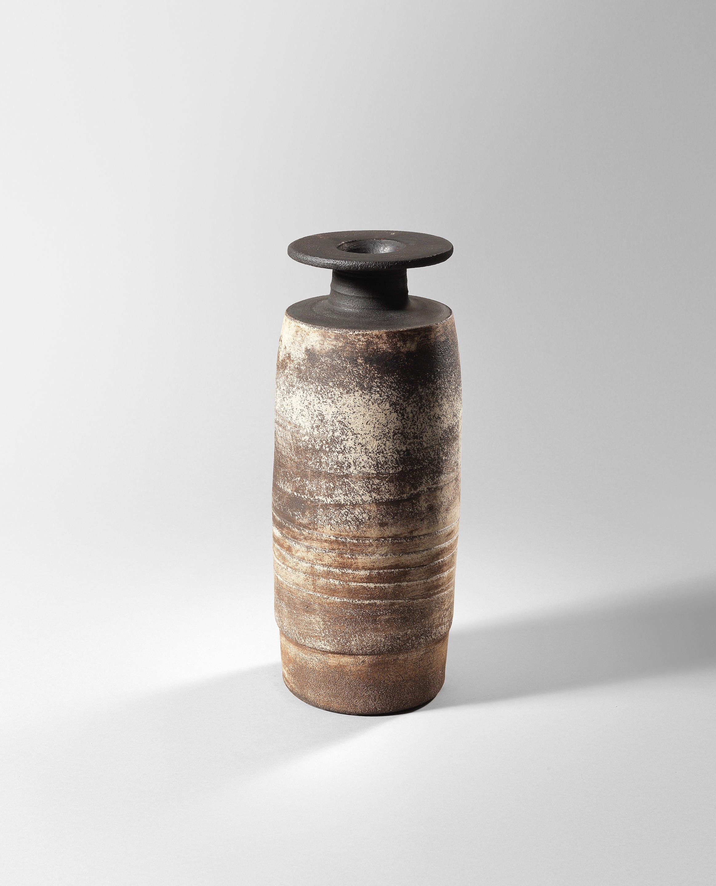 Hans Coper | Bottle vase with disc, (Circa 1957) | MutualArt