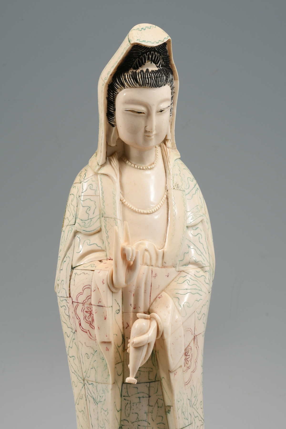 Yin Quan | Bone clad Quan Yin holding a bottle that holds the water of ...